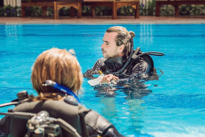 Diving Instructor and Students. Instructor Teaches Students To D Stock ...