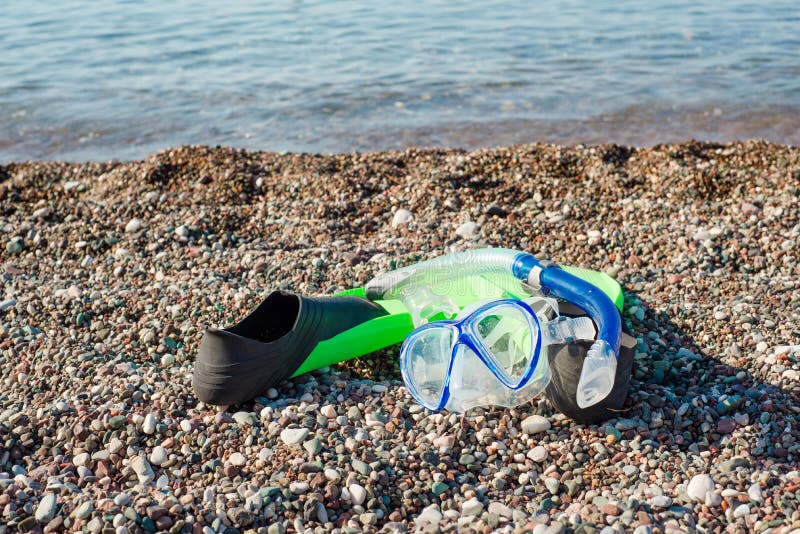 Diving Mask, Snorkel and Fins on a Beach Stock Image - Image of beach ...