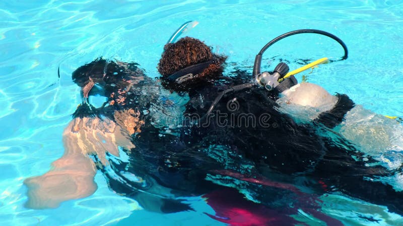 Diving in the Pool. Top View of the Instructor in Scuba Gear with an ...