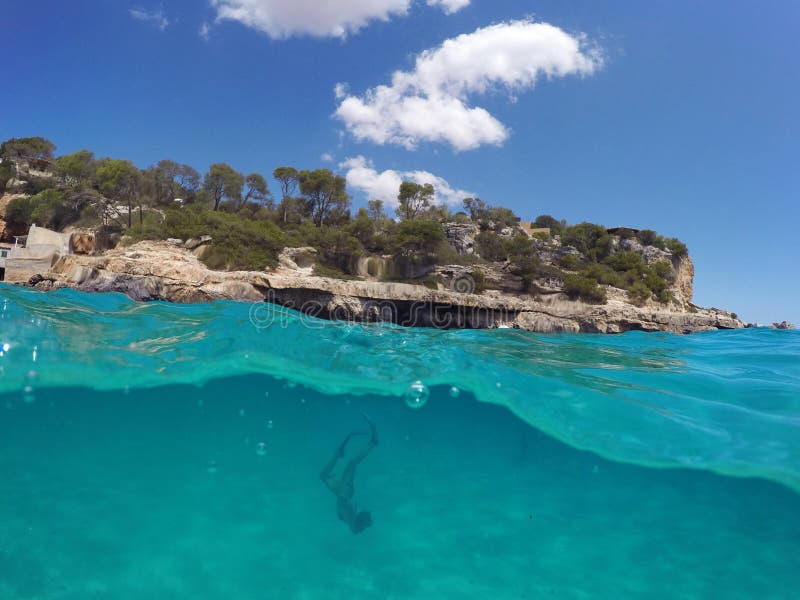 Diving under the waves stock image. Image of shore, coast - 158186989