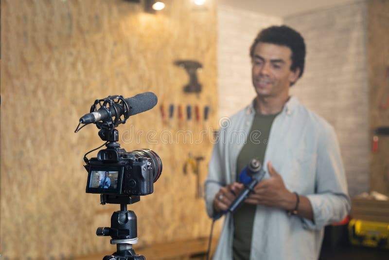 DIY Carpenter Filming a Blog about Drill with Focus on Camera and a ...