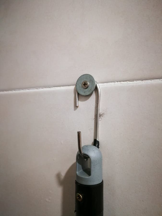 DIY or Do it Yourself Hanging Metal Sticking on the Bathroom Tile Wall ...