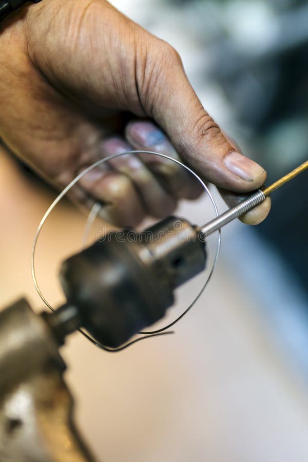 DIY, Metal String Wrapped Around Drill Stock Photo - Image of hand ...