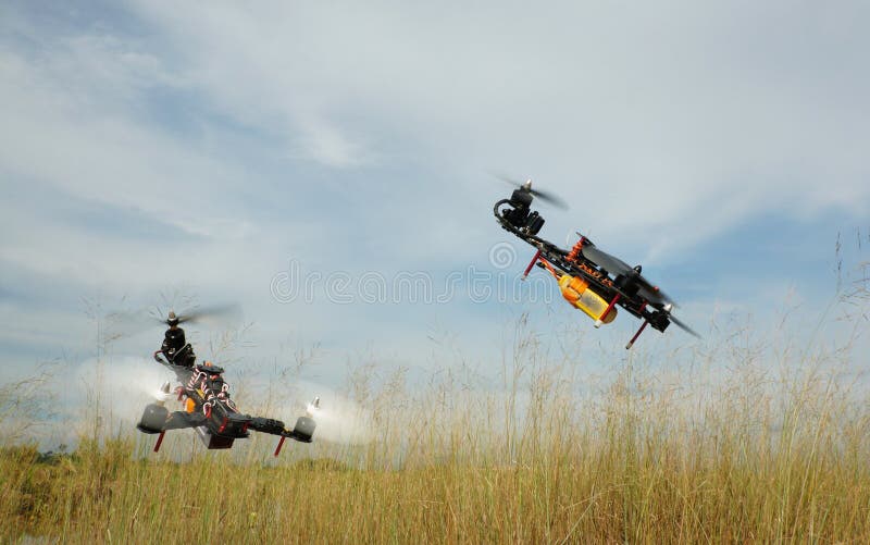 DIY Tricopter Drone Flying, Low Pass Above the Grass Field Stock Photo ...