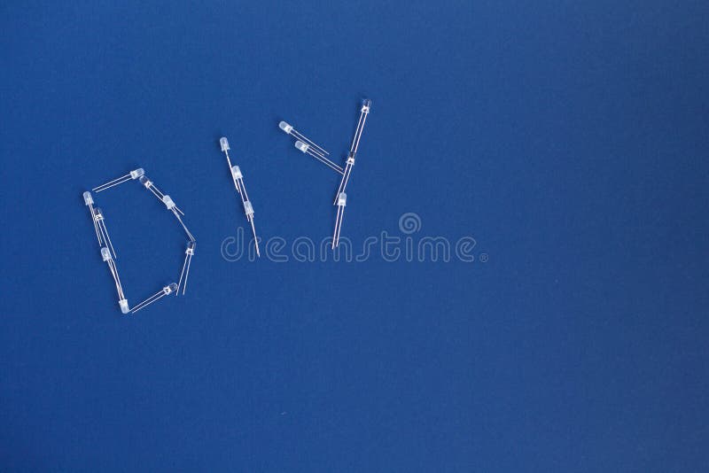 DIY Word from Diode and Phone on a Blue Background. DIY Words for Do it ...
