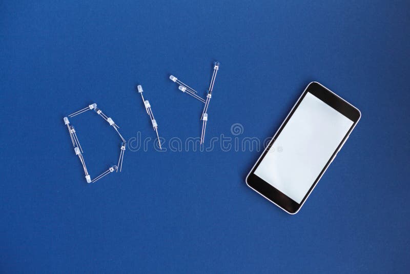 DIY Word from Diode and Phone on a Blue Background. DIY Words for Do it ...