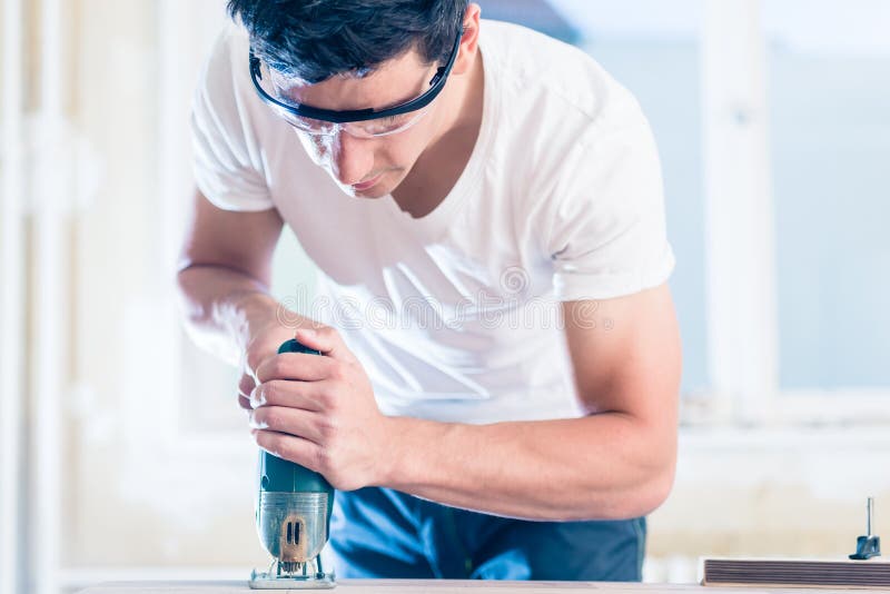 DIY Worker Cutting Wooden Panel with Jig Saw Stock Photo - Image of ...