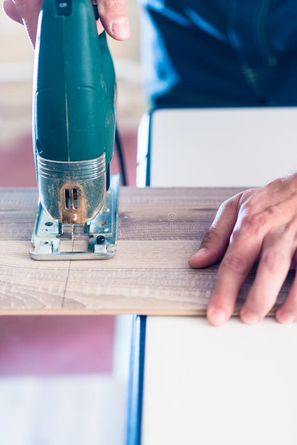 DIY Worker Cutting Wooden Panel with Jig Saw Stock Photo - Image of ...