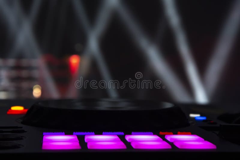 The DJ Console is on the Stage, and Spotlights are Shining in the Hall ...