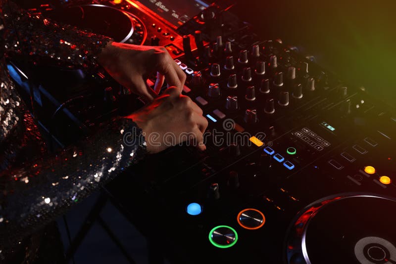 DJ Creating Music on Modern Console Mixer in Night Club, Closeup Stock ...