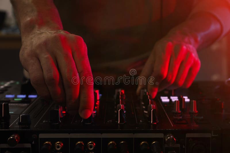 DJ Creating Music on Modern Console Mixer in Night Club, Closeup Stock ...