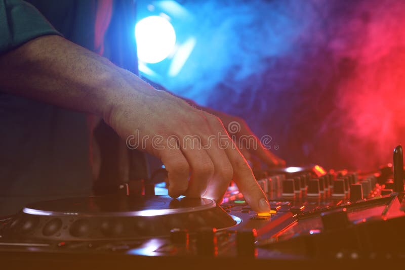 DJ Creating Music on Modern Console Mixer in Night Club, Closeup Stock ...
