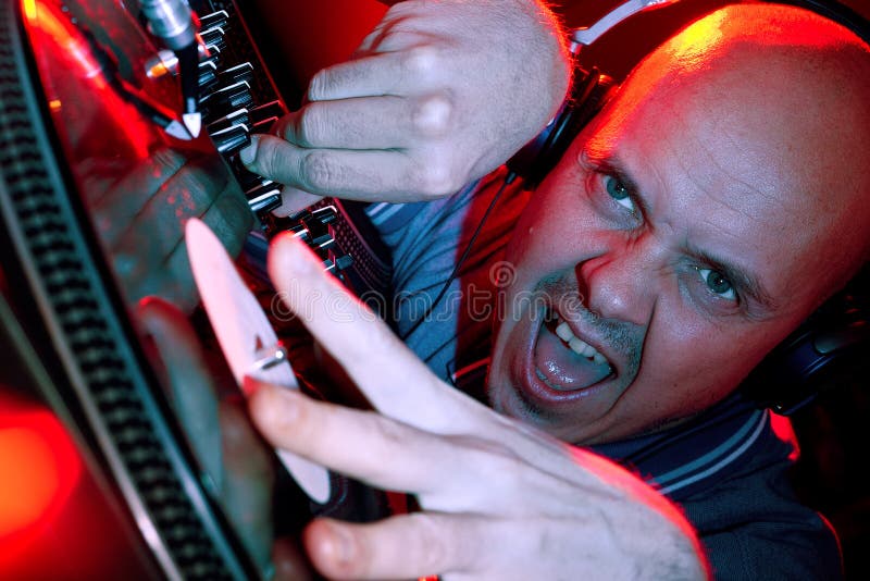 DJ driving the crowd wild stock image. Image of rave - 27927989