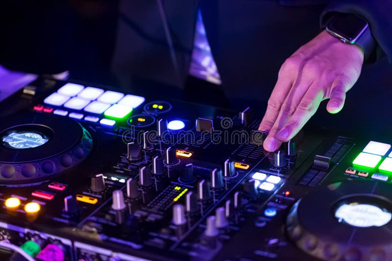 DJ Hands Mixing and Regulating Music on Dj Console Mixer at a Night ...