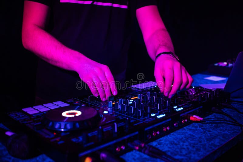 DJ Mixes Electronic Music with His Hands on a Music Controller Stock ...