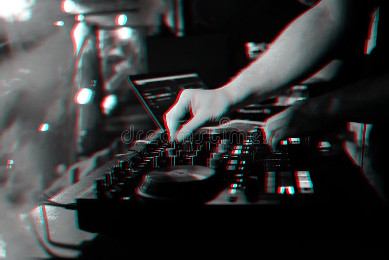 DJ Mixes Music on a Professional Controller Board in a Nightclub at a ...