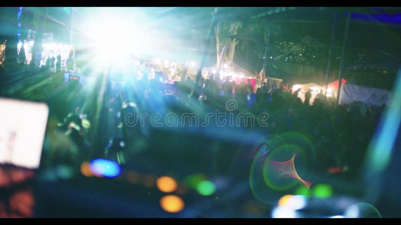 DJ Playing in a Large Trance Party with Large Crowd of People Dancing ...