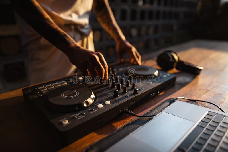 DJ Playing Music,Man Using Mixing Desk at Party Out in the Evening ...