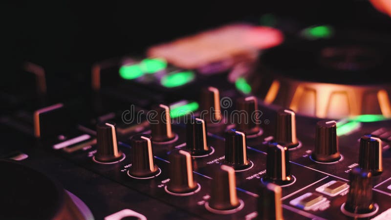 Dj Playing Music at the Mixer Controller in a Night Club Stock Footage ...