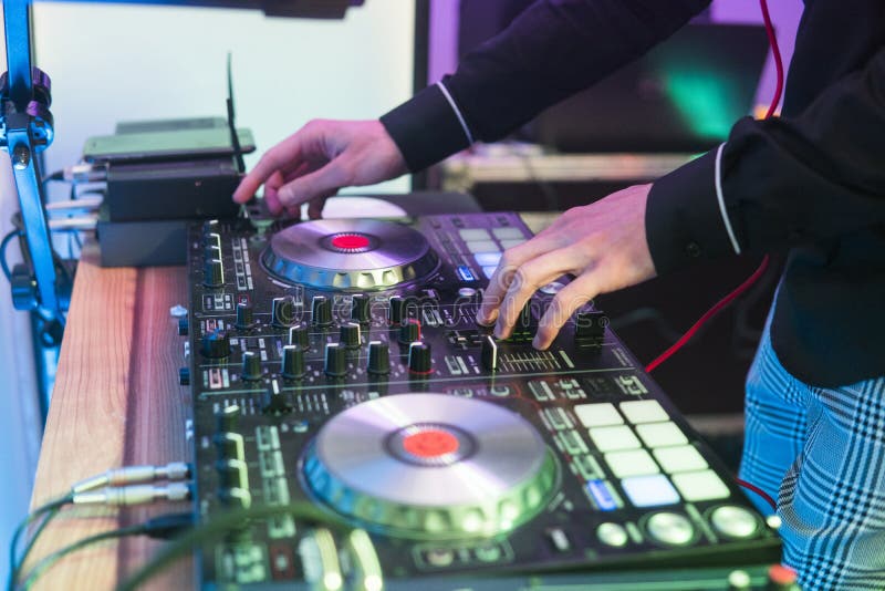 DJ Plays and Mix Music on Digital Mixer Controller. Close-up DJ ...