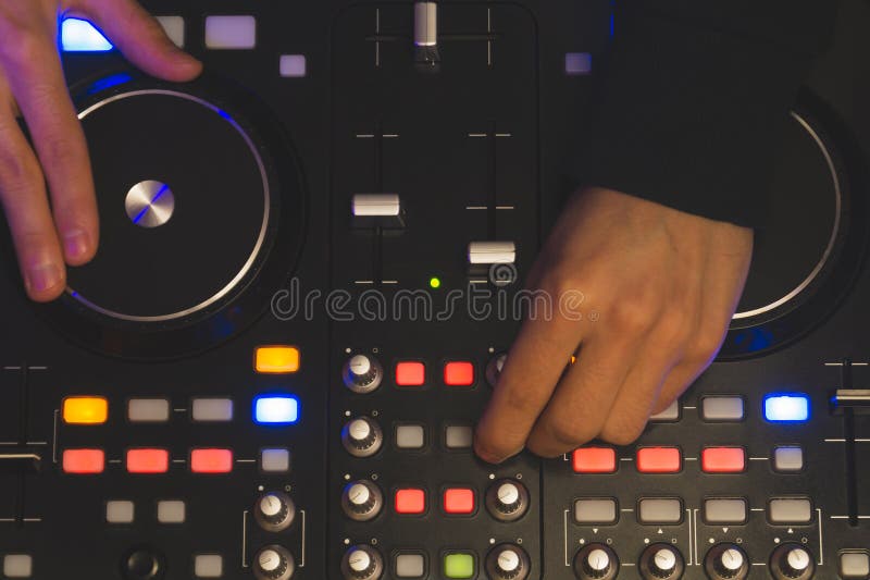 DJ Plays Music. Sound Mixer Controller with Knobs and Sliders. Hands on ...