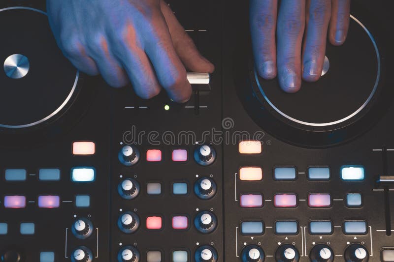 DJ Plays Music. Sound Mixer Controller with Knobs and Sliders. Hands on ...