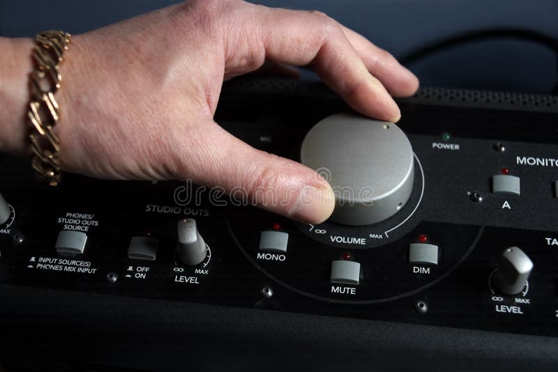 DJ Pushing Volume Up stock image. Image of equipment - 87576735