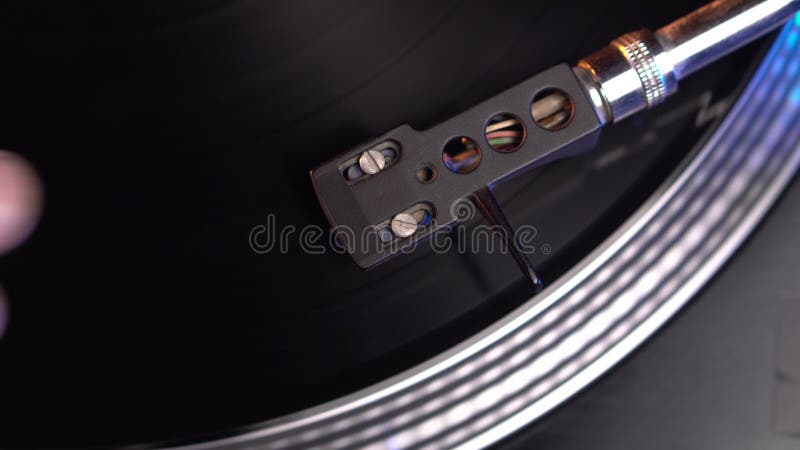 DJ Scratching Vinyl Record on Professional Turntable Player, High Angle ...