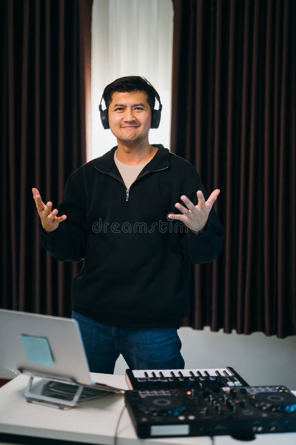 DJ Spinning with a Mixer Console at a Home Disco Event Stock ...