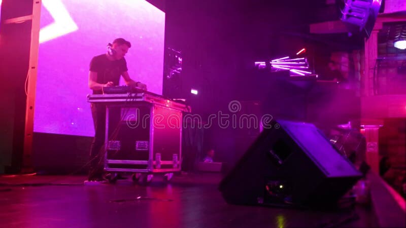 DJ is Standing Behind the His Workplace on a Stage Stock Video - Video ...