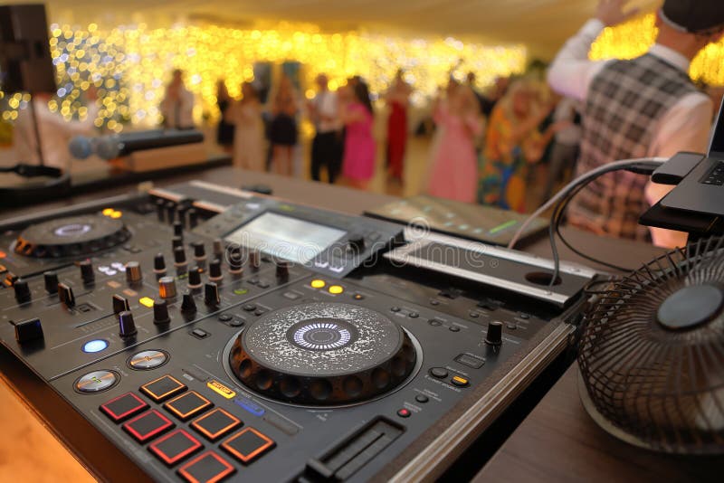 DJ Table Mixer Closeup during the Event or Wedding Party and Dancing ...