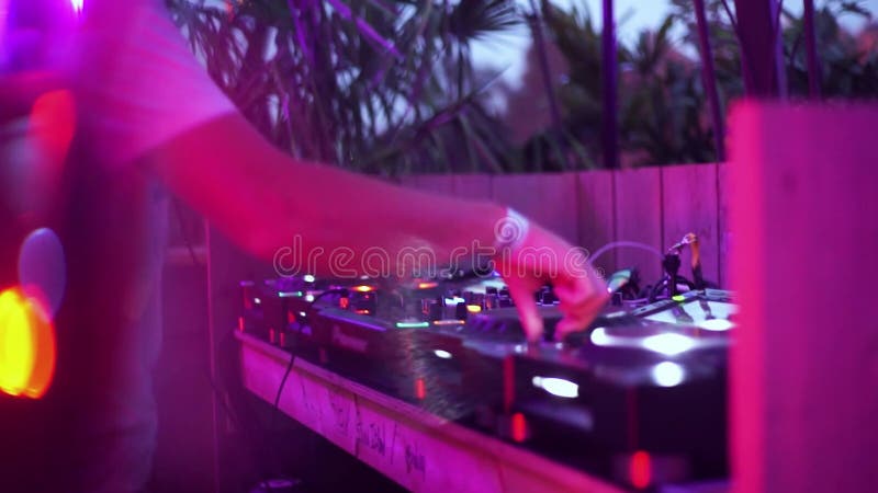 DJ Using a Professional Turntable and Mixer during a Live Performance ...