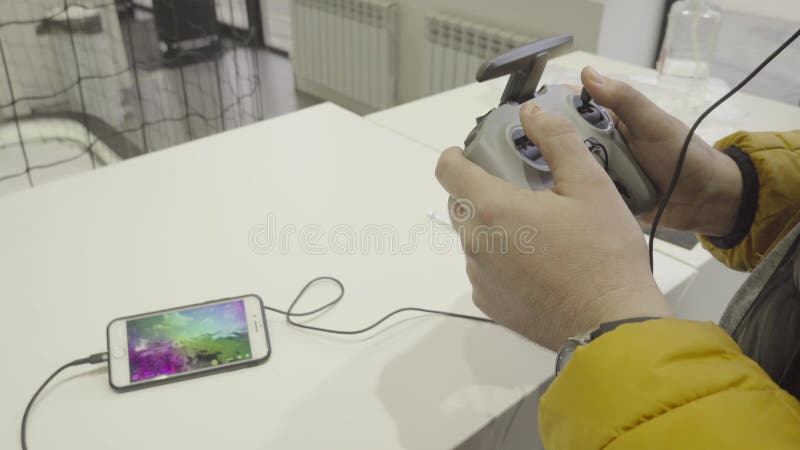 DJI Modern Remote Control Panel and Hands on Controls for Drone. Stock ...