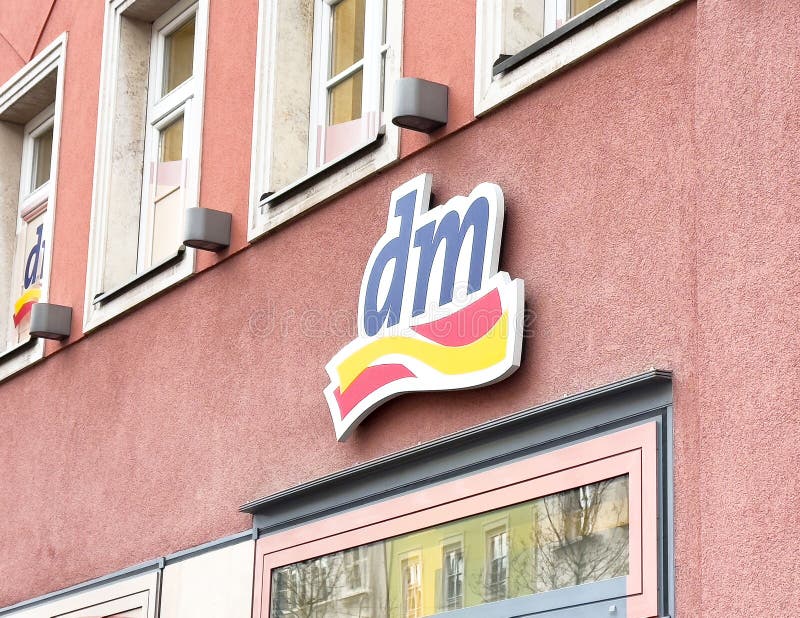 Dm Storefront Exterior with Logo on Pink Building Wall Editorial Image ...