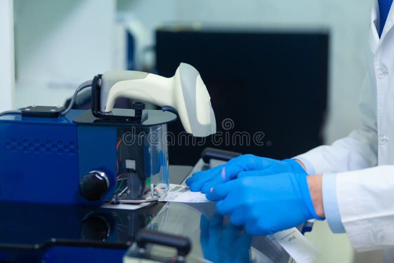 DNA Laboratory. the Expert Puts the Human DNA into the Database Using ...