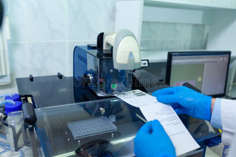 DNA Laboratory. the Expert Puts the Human DNA into the Database Using ...