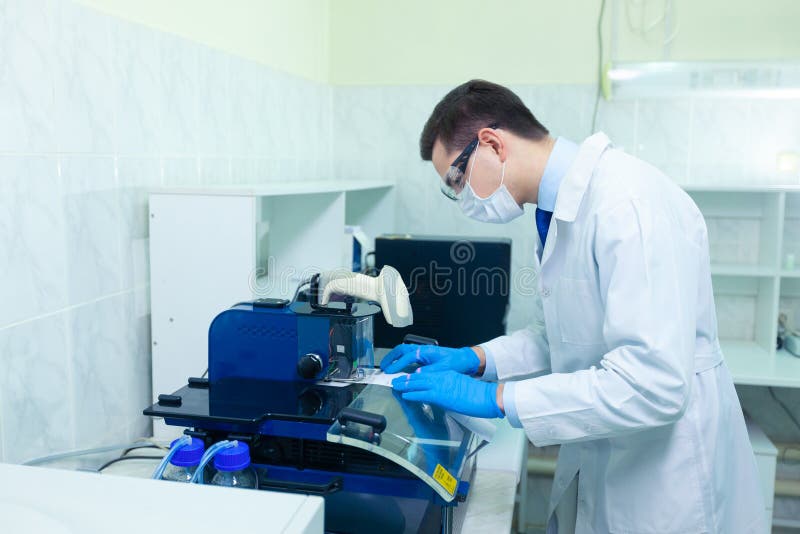 DNA Laboratory. the Expert Puts the Human DNA into the Database Using ...