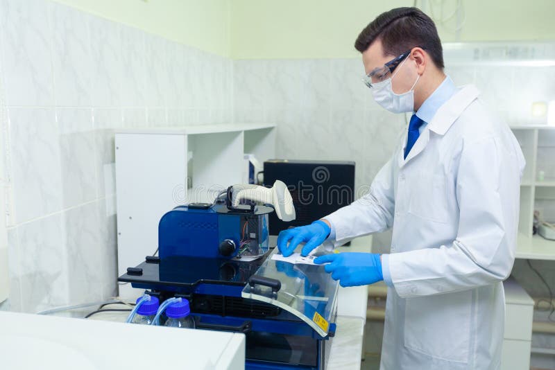 DNA Laboratory. the Expert Puts the Human DNA into the Database Using ...