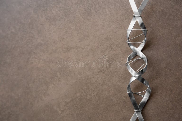 DNA Molecule Model Made of Metal on Brown Background, Top View. Space ...
