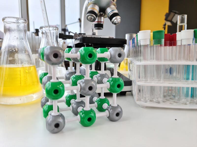 DNA Molecule in Test Tubes and Microscope in Laboratory Stock Photo ...