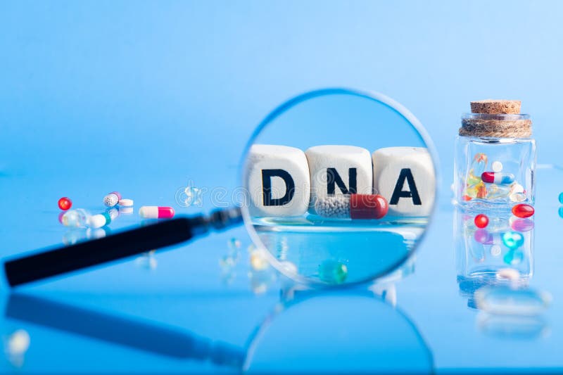 DNA Pill on the Background of a Laboratory Table with Medicines and ...