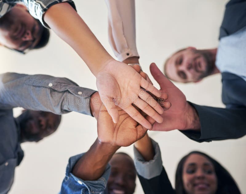 We Do it Better when we Do it Together. Low Angle Shot of a Team of ...