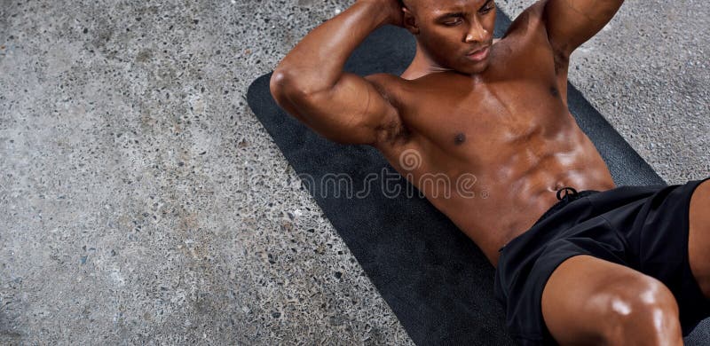 Do it until they Cant Stop Staring. a Sporty Young Man Doing Sit Ups As ...
