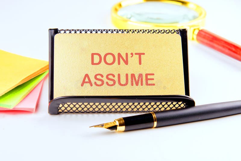 Do Not Assume on a Gold-colored Money Card Stock Photo - Image of ...