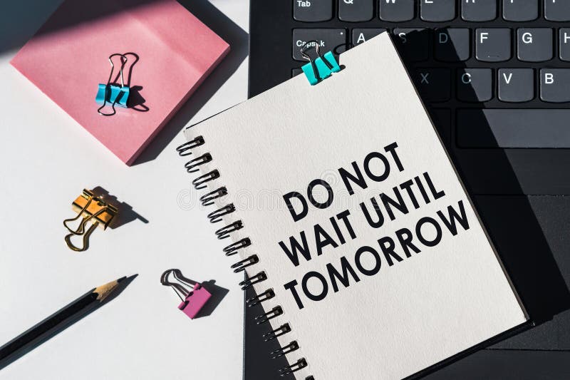 Do Not Wait until Tomorrow Text on Notebook with Keyboard Stock Image ...