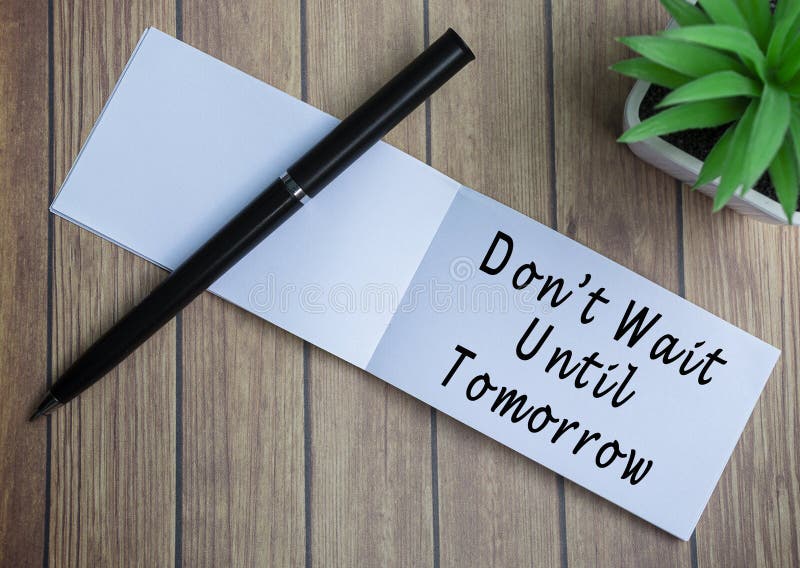 Do Not Wait until Tomorrow Text on Notepad with Potted Plant on a ...