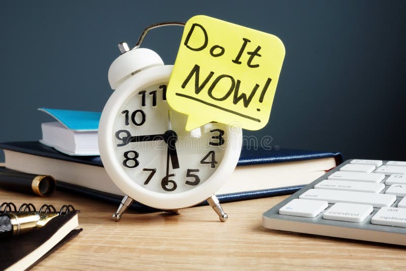 Do it Now. Alarm Clock on the Office Table. Stock Image - Image of ...
