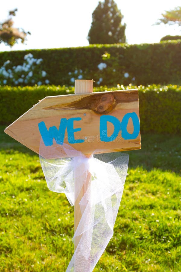 We Do Sign Points To Ceremony Stock Image - Image of wood, blue: 60915571