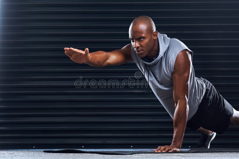 Do What Needs To Be Done. a Handsome Young Man Doing Push-ups. Stock ...