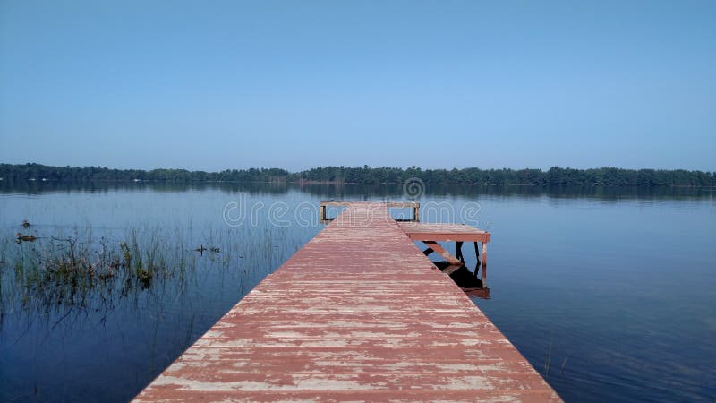 Dock of beautiful red blue stock image. Image of blue - 146610413